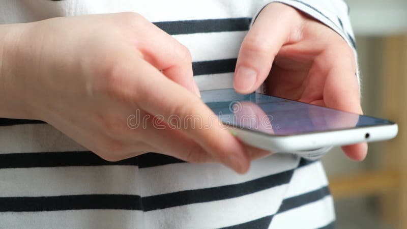 Typing on a Smartphone, Hands in Close-up Typing a Message on a Mobile ... Typing on a Smartphone, Hands in Close-up Typing a Message on a Mobile ...