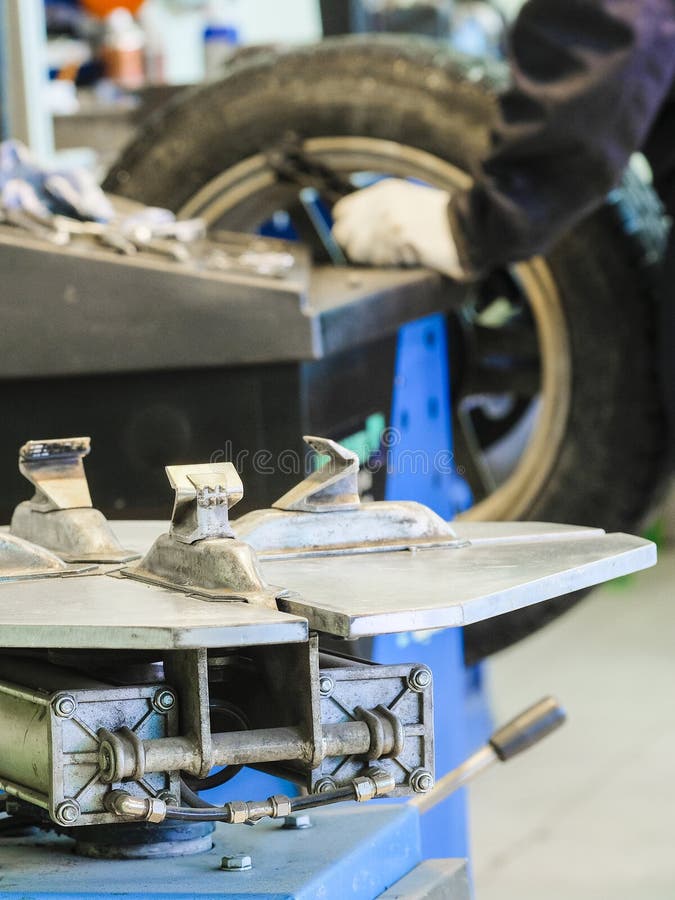 Tyre fitting equipment stock photo. Image of paint, engine - 99457788