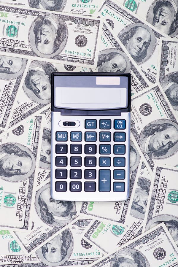 Dollars on Calculator and White Label with Text Top 5 on it Stock Photo ...