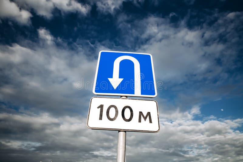 U-turn Place Road Sign on Blue Sky with Clouds. Wrong Turn Stock Image ...