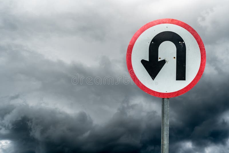 U Turn Sign on White Dark Cloud Background Stock Image - Image of ...