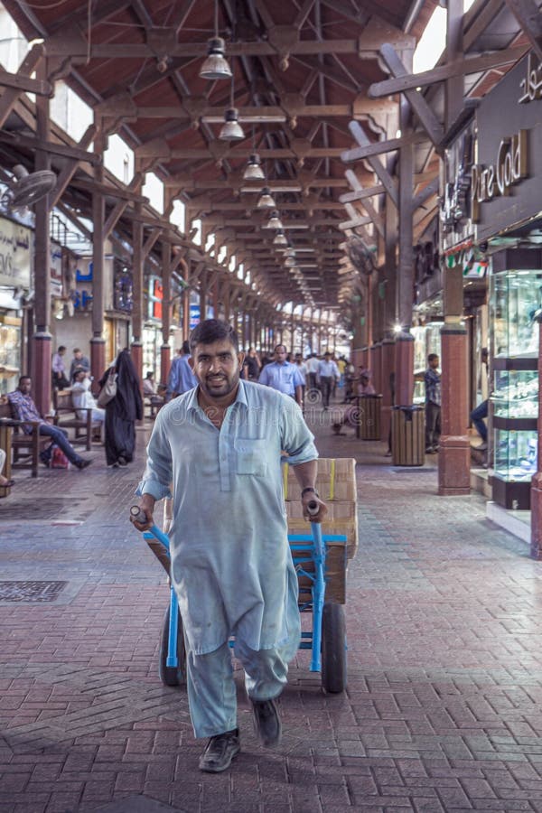 UAE / DUBAI 10/4/2012 - Local Worker Loading Load Editorial Photography ...