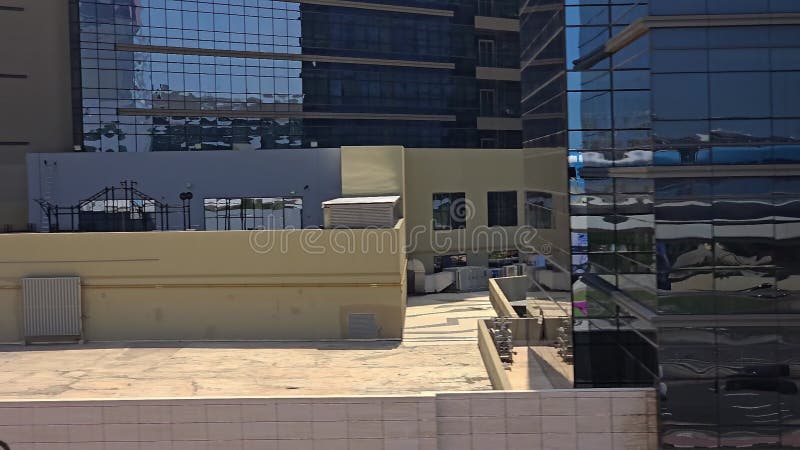 UAE, Dubai 01 May 2024 Distorted Reflection of Train on Building ...