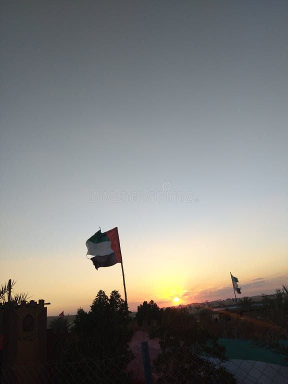 Uae flag with sunset dxb stock image. Image of skyline - 217909505