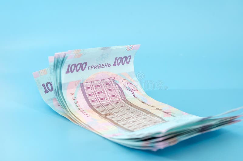 1000 UAH Banknotes Isolated on a Blue Background. Stock Image - Image ...