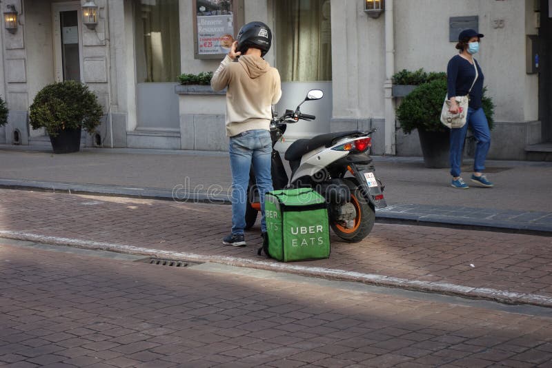 Uber Eats delivery man editorial stock image. Image of carrier - 199509269