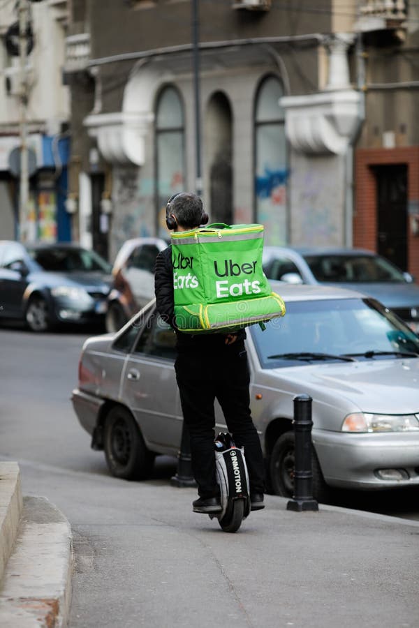 Uber Eats Delivery Man on Monowheel in Bucharest during the Covid-19 ...