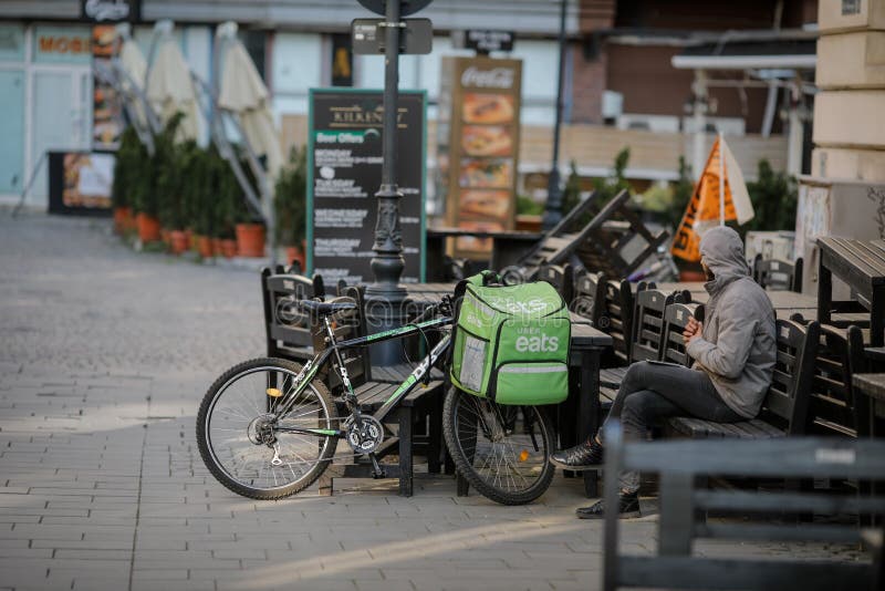 Uber Eats Delivery Man Waiting on the Empty Streets of Old Town ...