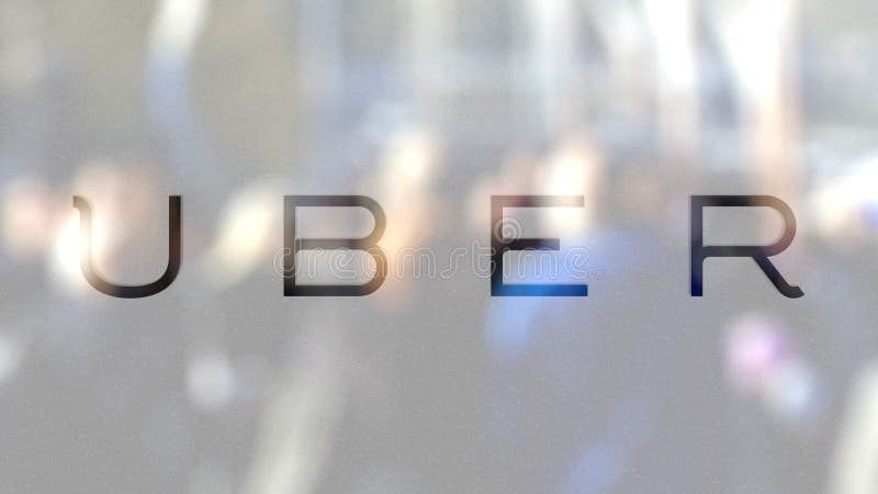 Uber Technologies Inc. Logo on a Glass Against Blurred Crowd on the ...