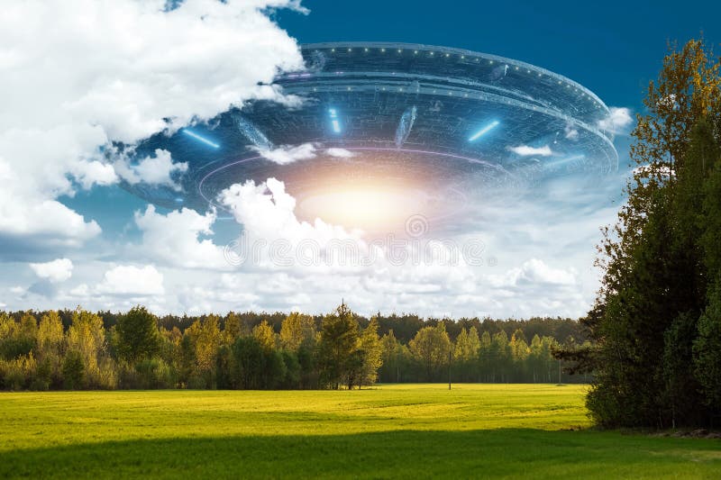 UFO, an Alien Saucer Hovering Above the Field in the Clouds, Hovering ...
