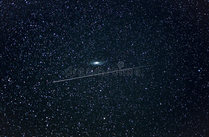 UFO Passing the Andromeda Galaxy Stock Photo - Image of flying, bolid ...