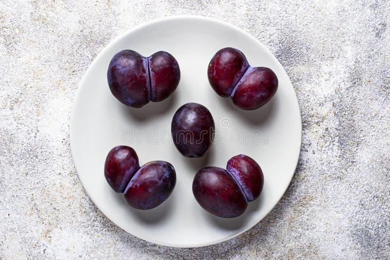 Ugly and Normal Plums. Abnormal Organic Fruit Stock Photo - Image of ...