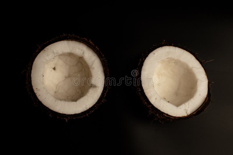 Ugly Organic Coconut On A Black Background, Isolate. A Broken Nut In A ...