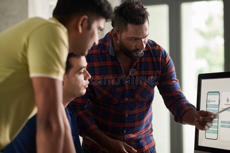 UI Designers Discussing Mobile App Design Stock Image - Image of ...