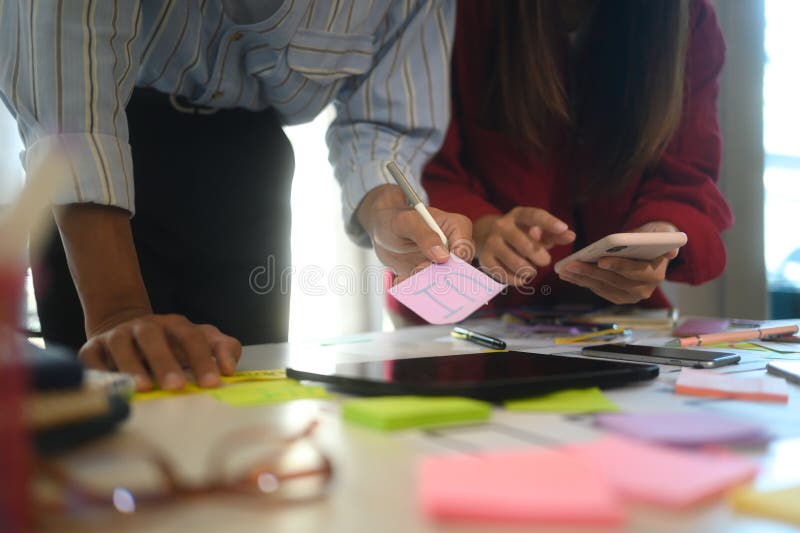 UI UX Designers Analyzing Colorful Charts and App Interface Wireframes ...