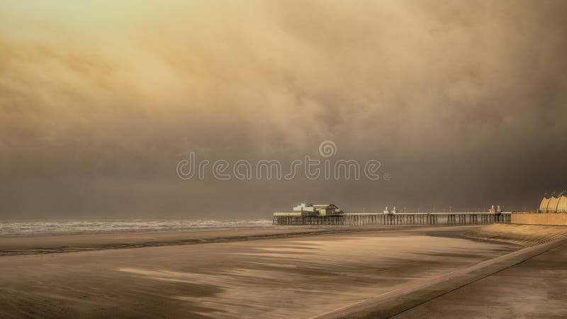 UK, Blackpool: Moody Beach Scene with Pier, Sunlight, and Storm Clouds ...