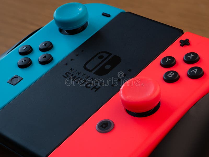 UK, March 2020: Nintendo Switch Joy Con Grip Red and Blue Editorial ...