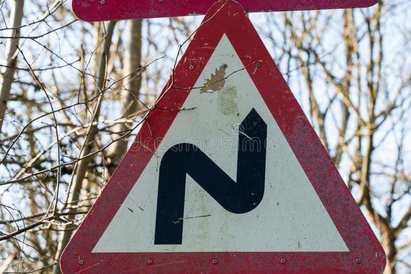A UK Traffic Sign Stating Winding Road with a Read and White Warning ...