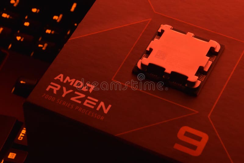 A Close-up of an AMD Ryzen 9 7900X Processor in a Packaging Box with ...