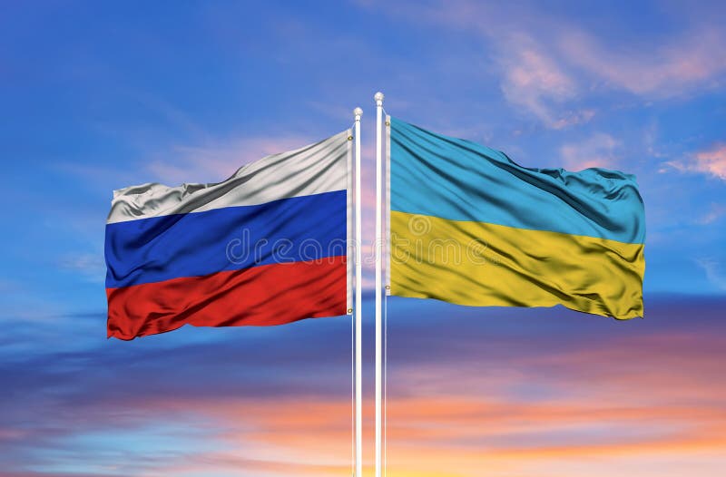 Ukraine and Russia Two Flags on Flagpoles and Blue Sky Stock ...