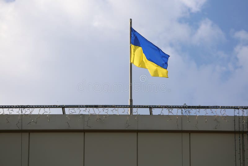 Ukrainian Flag on Building Against Cloudy Sky Stock Image - Image of ...
