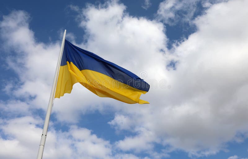 Ukrainian Flag Flying With The Background Of Blue Sky And White Stock