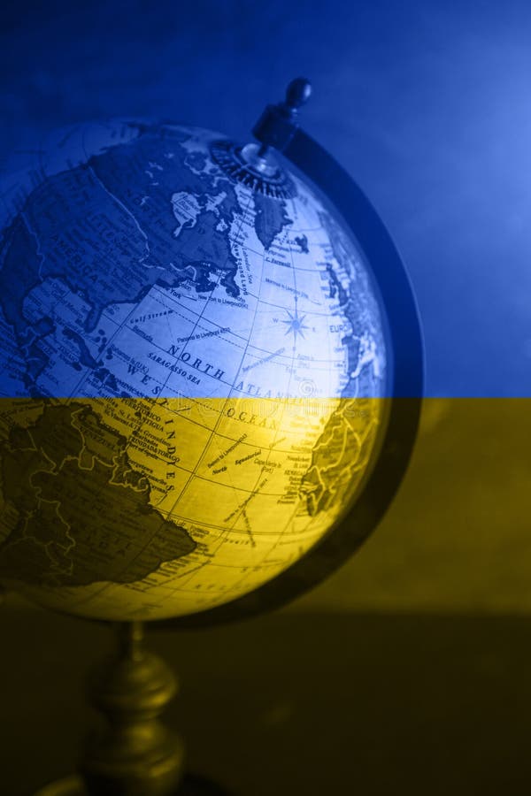 A Ukrainian Flag Over the Globe on a Dark Background Stock Photo ...