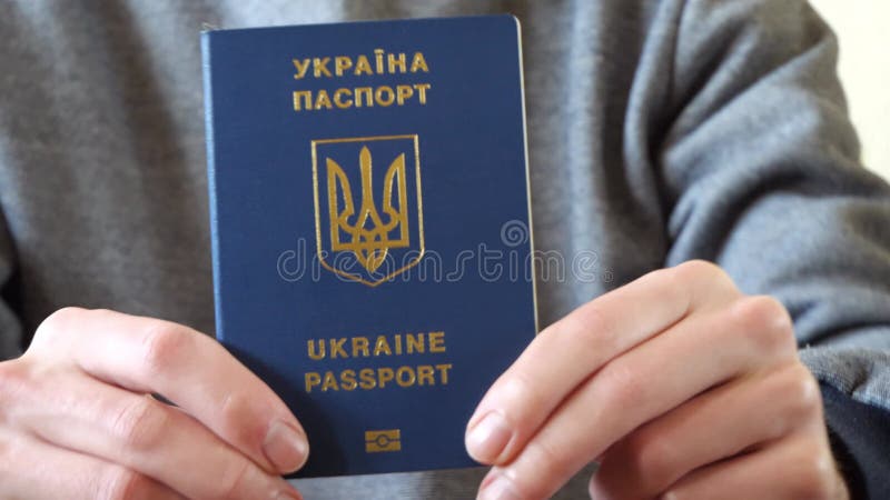 Ukrainian Foreign Biometric Passport In Hand Close Up Stock Footage