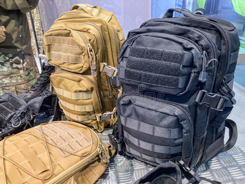 Ukrainian Military-style Backpacks on a Reflective Surface, One Olive ...