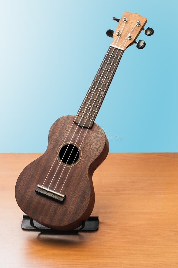 Ukulele in Front View on Wood with Isolated Blue Background, Close Up ...
