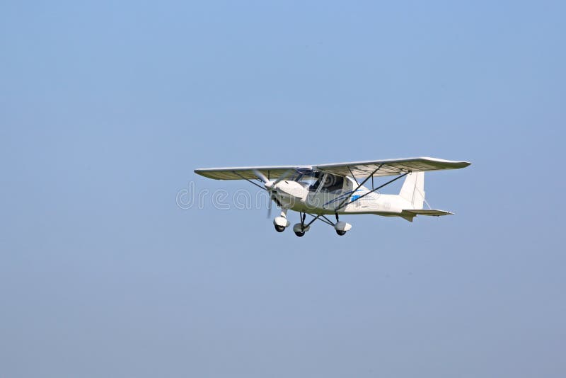 Ultralight Airplane Flying in a Blue Sky Stock Photo - Image of ...