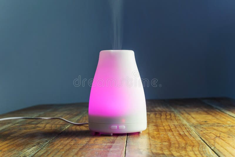 Ultrasonic Essential Oil Diffuser with Purple Light Stock Photo - Image ...