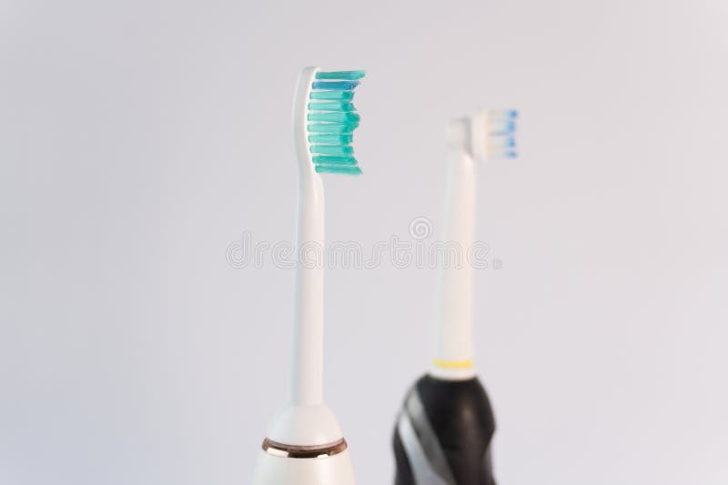A Unique Toothbrush Standing in an Ornate Faucet Sink Against a Tiled ...