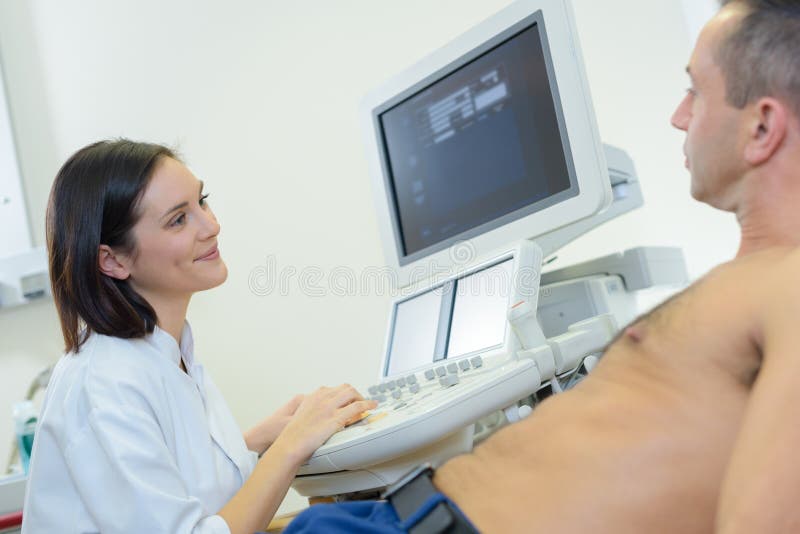 Ultrasound Procedure for Patient Stock Photo - Image of reading, smile ...