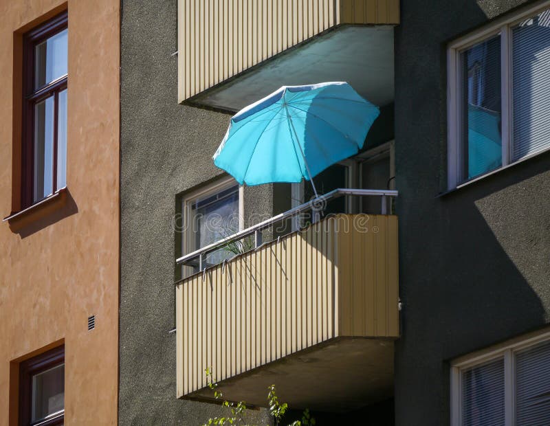 An Umbrella at a Balcony on the Side of a Building Stock Image - Image ...