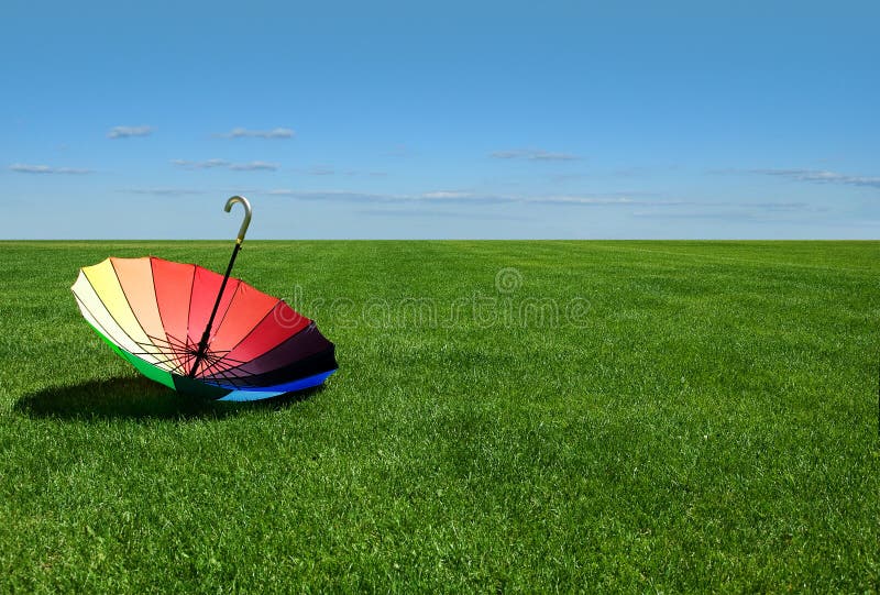 Umbrella on a grass stock photo. Image of landscape, blue - 19790458