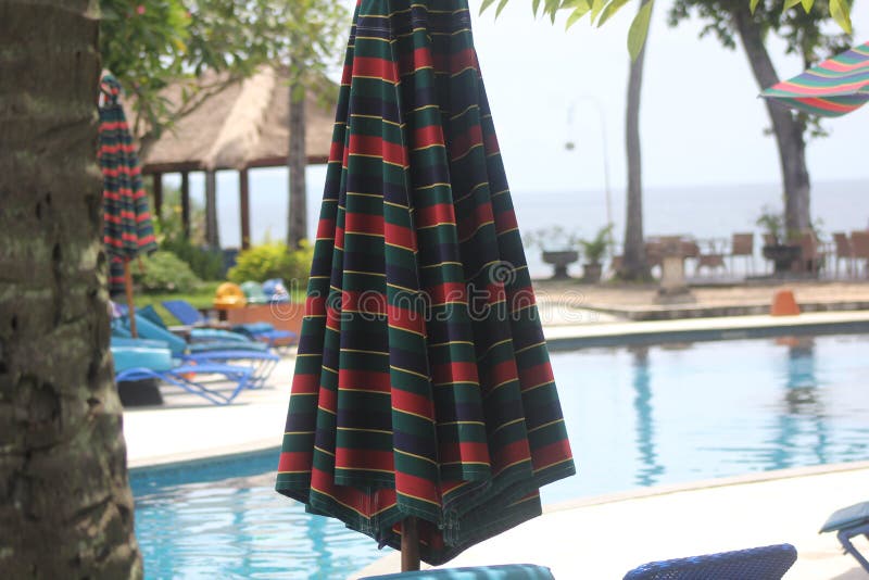 Umbrella Made of Cloth with a Plaid Pattern in a Hotel Swimming Pool ...