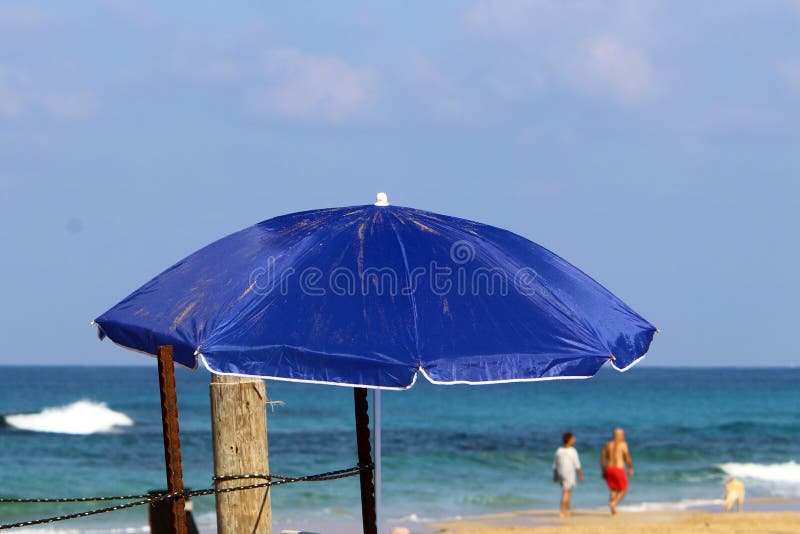 Umbrella by the sea stock photo. Image of mediterranean - 128352472