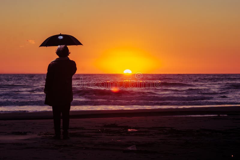 Umbrella Strobist - Boy Stationary on Beach Stock Image - Image of ...