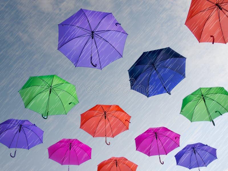 Umbrellas Against Grey Sky. Stock Photo - Image of colour, weather ...