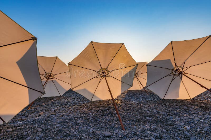 Umbrellas on the Stone Beach. Stock Photo - Image of coast, collection ...