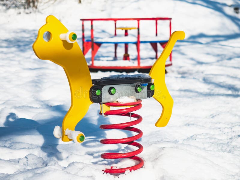 Umping Horse on a Spring on the Playground Under the Snow Stock Photo ...