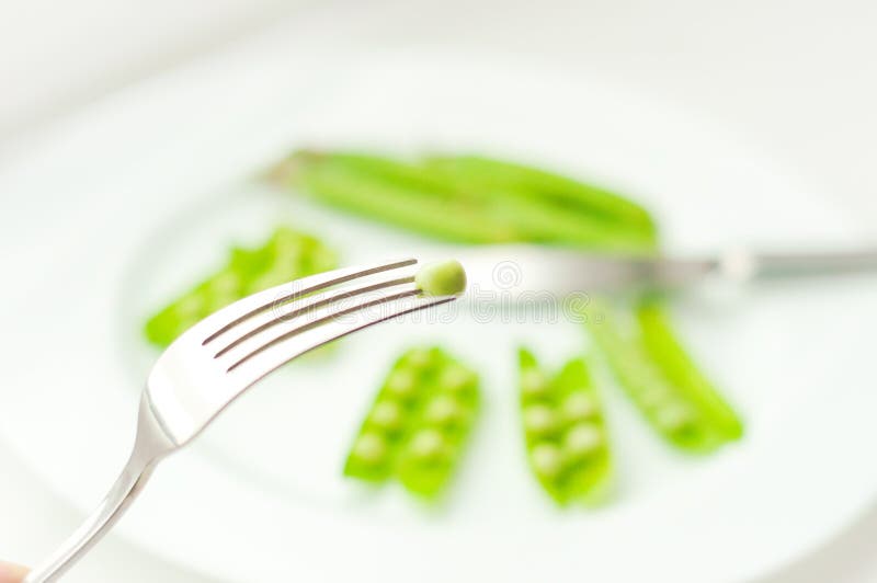 Un pisello sulla forcella fotografia stock. Immagine di immagine - 66165120