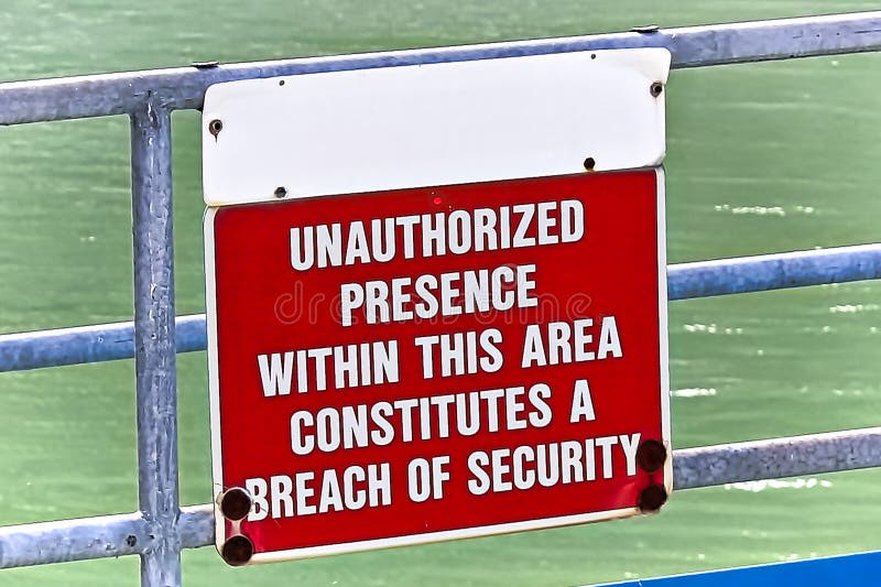 A Unauthorized Presence within the Area is a Security Breach Sign Stock ...