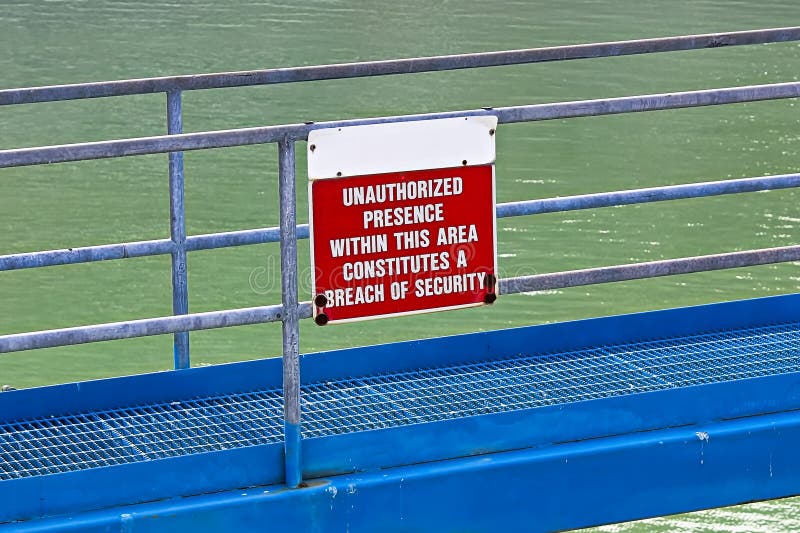 A Unauthorized Presence within the Area is a Security Breach Sign Stock ...