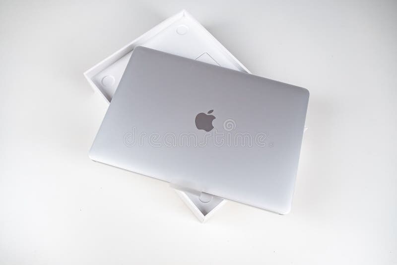 Unboxing a Silver Macbook Air on a White Table. Apple Laptop Editorial ...