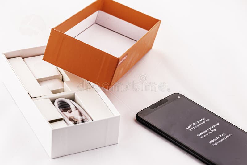 Unboxing of a Smartphone with Its Charger in a Box Stock Image - Image ...