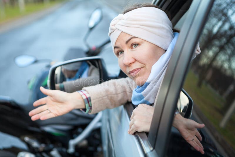 Uncomprehending Lady Driver Makes a Helpless Gesture while Sitting ...