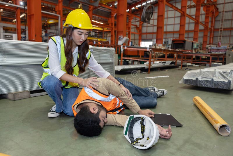 Unconscious Engineer Worker Getting First Aids Help from His Female ...