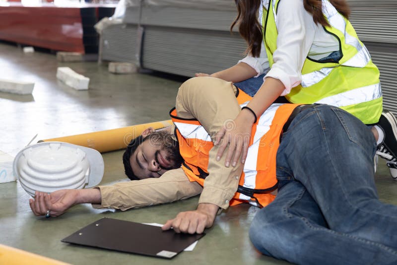 Unconscious Engineer Worker Getting First Aids Help from His Female ...